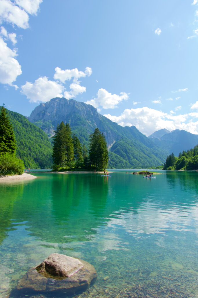 Hiking in the Julian Alps among flowers, a lake and stunning views ...